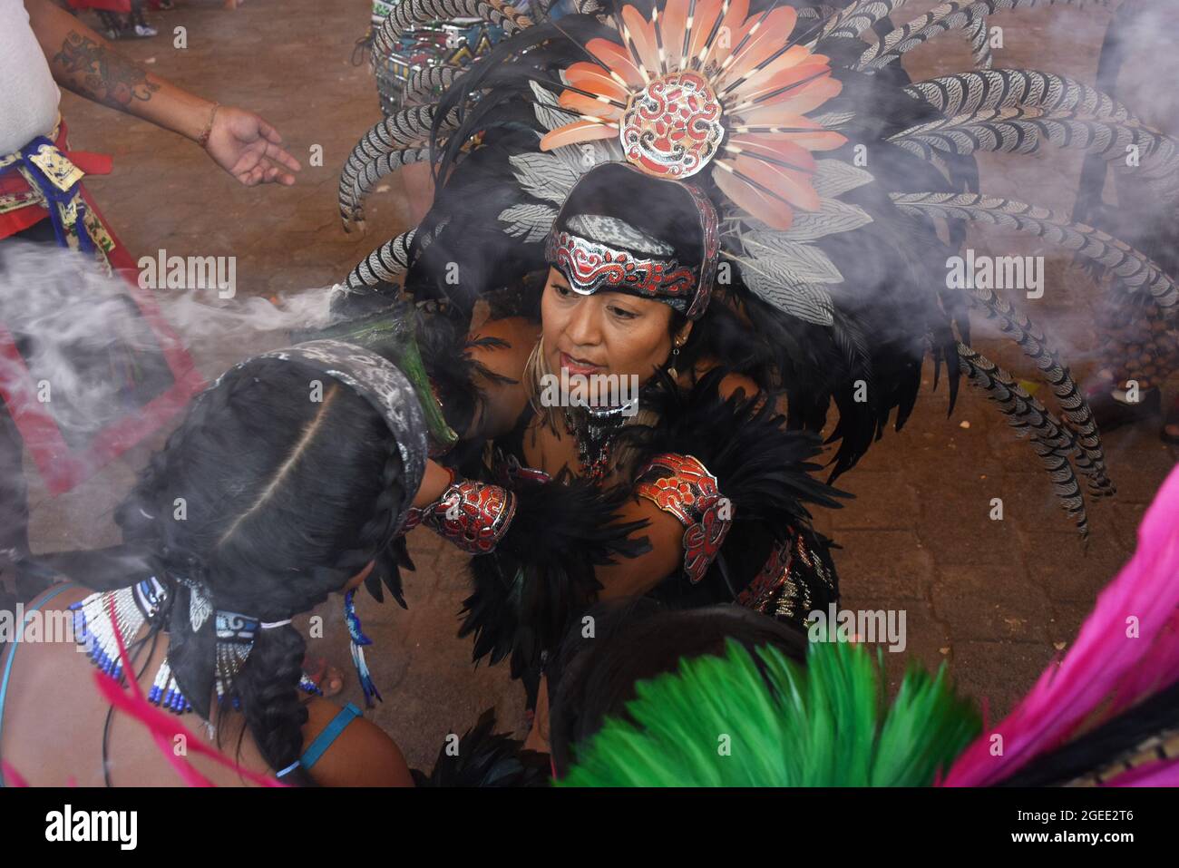 Before participating in a ceremonial dance, dancers undergo a ...