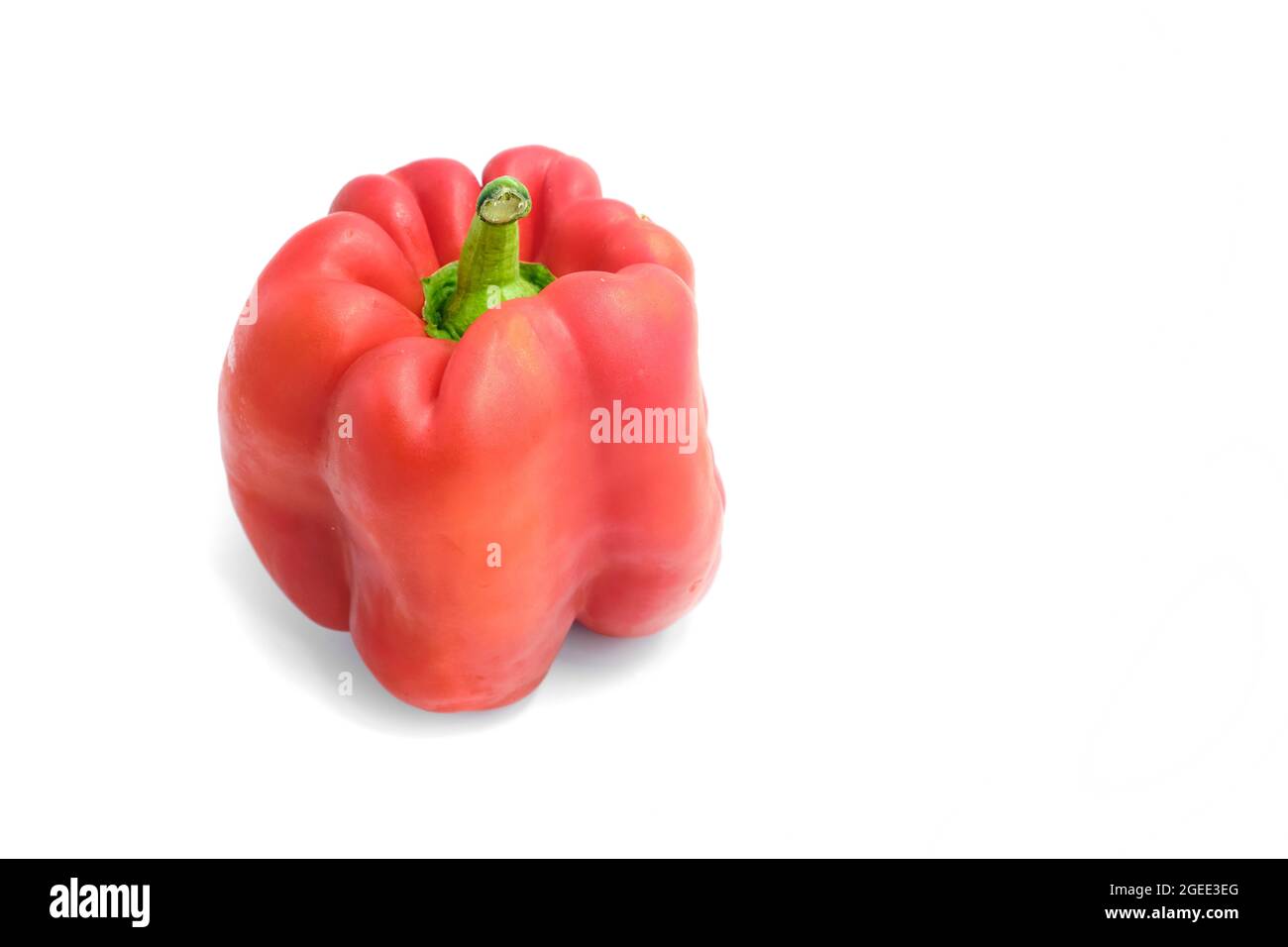 Big red pepper on white background Stock Photo - Alamy