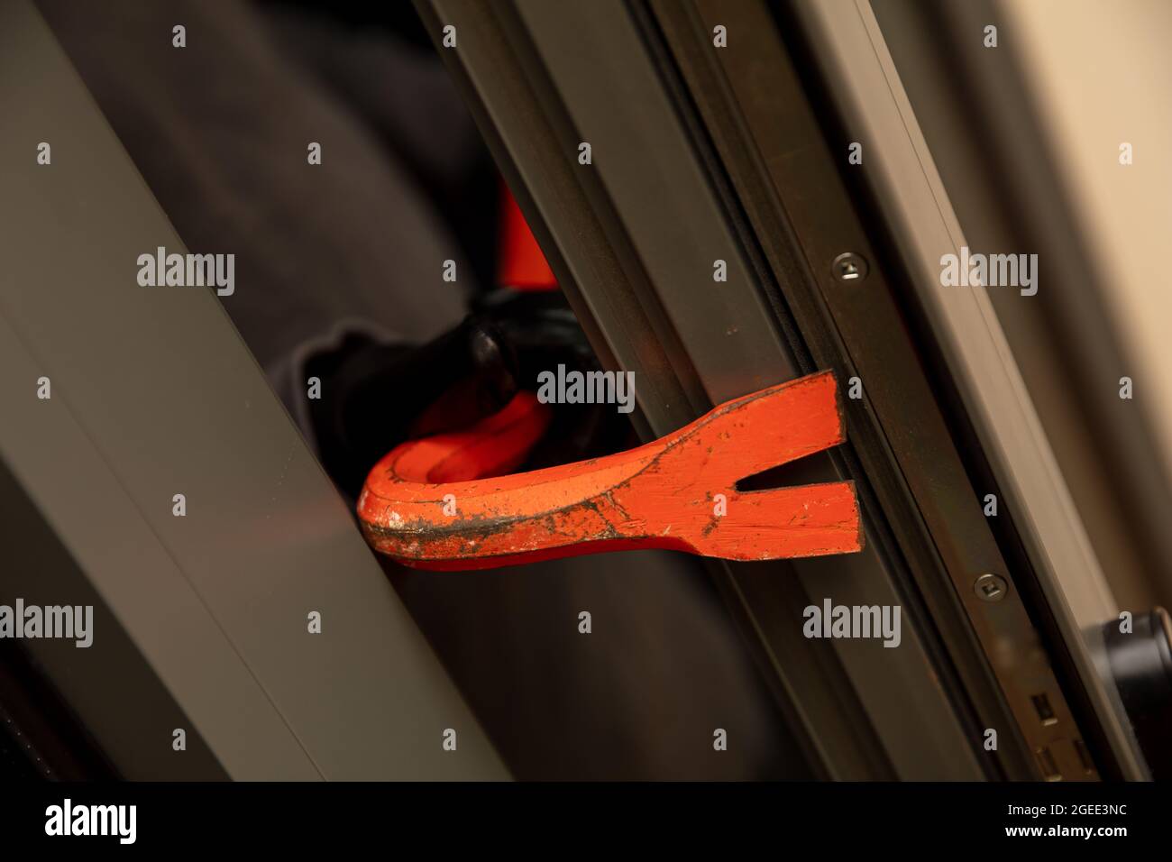 Housebreak with crowbar. Burglar breaking a house aluminum door, for ...