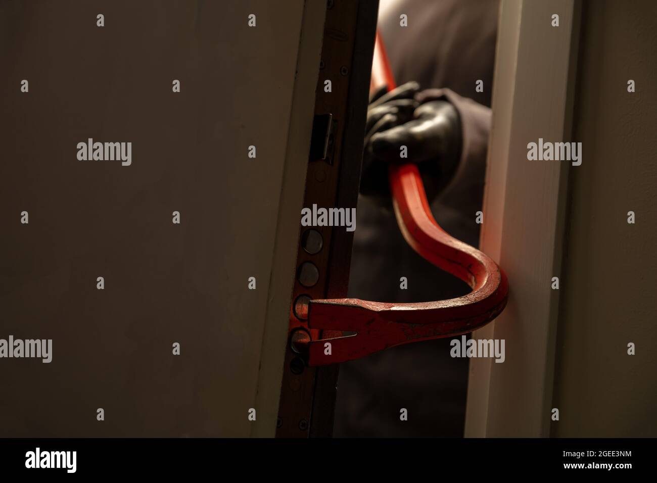 Burglar breaking a house aluminum door, for entering a house and ...