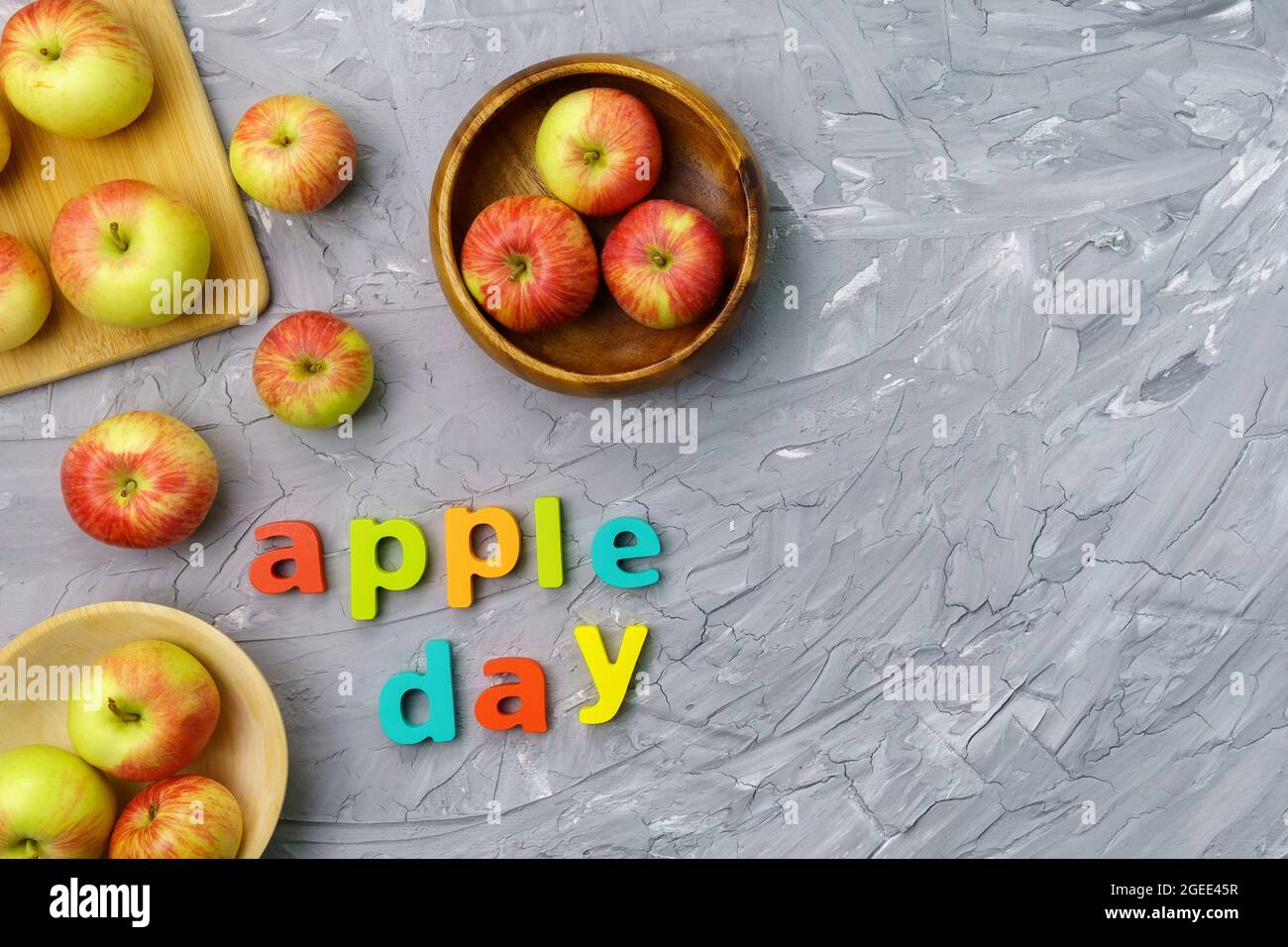 Apple is a national holiday on October 21. Red apples on a gray ...