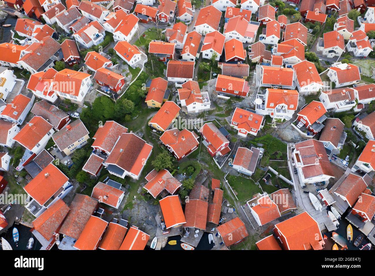 Aerial view of red rooftops and buildings in densely residential area ...