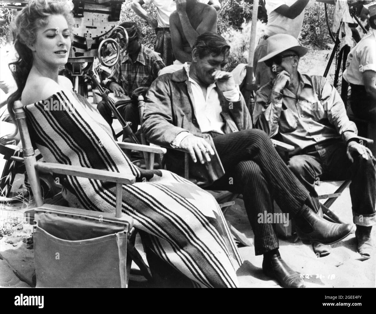 ELEANOR PARKER CLARK GABLE and Director RAOUL WALSH on set location ...