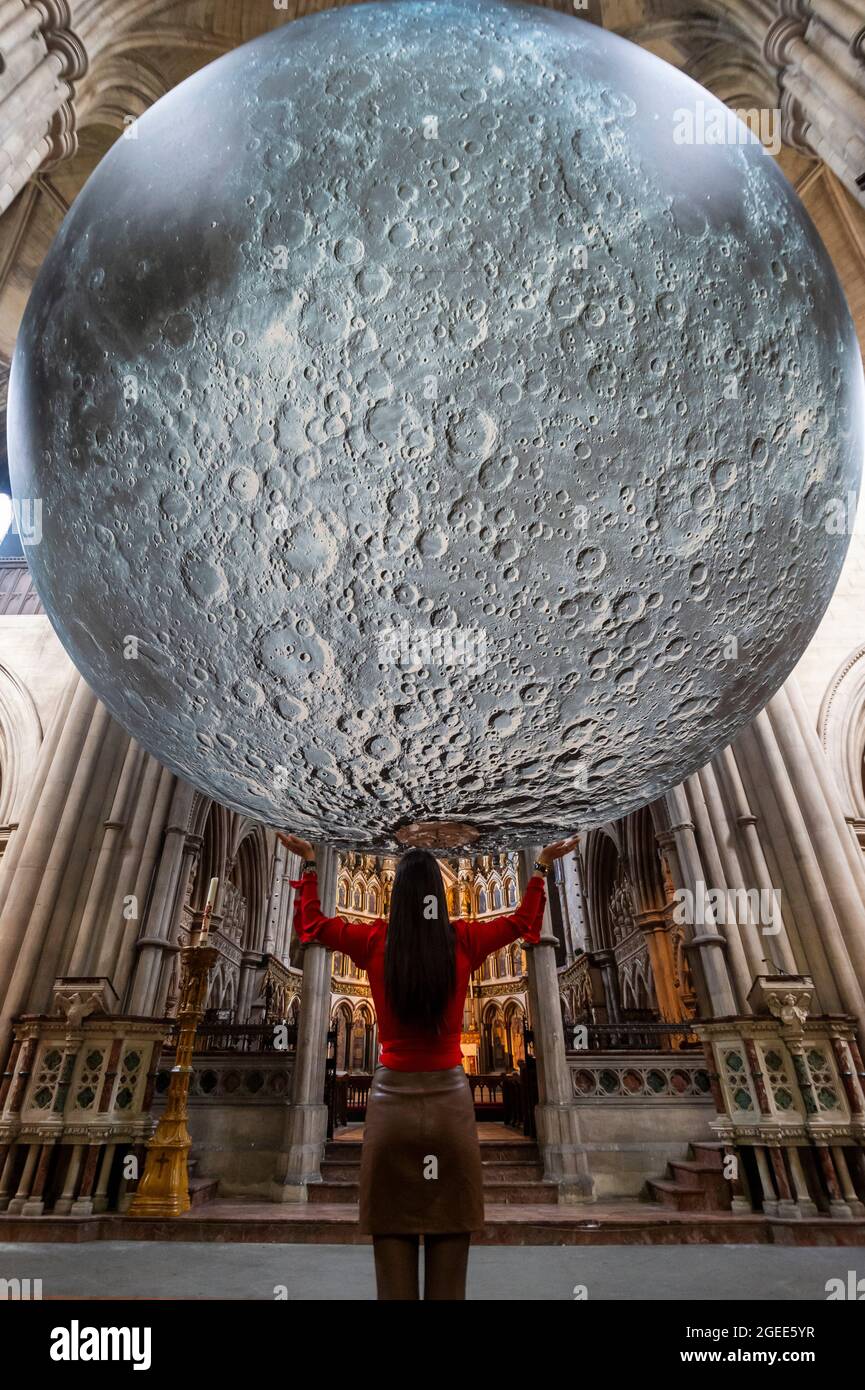 London, UK. 19 August 2021. A visitor poses with Luke Jerram ‘s Museum ...
