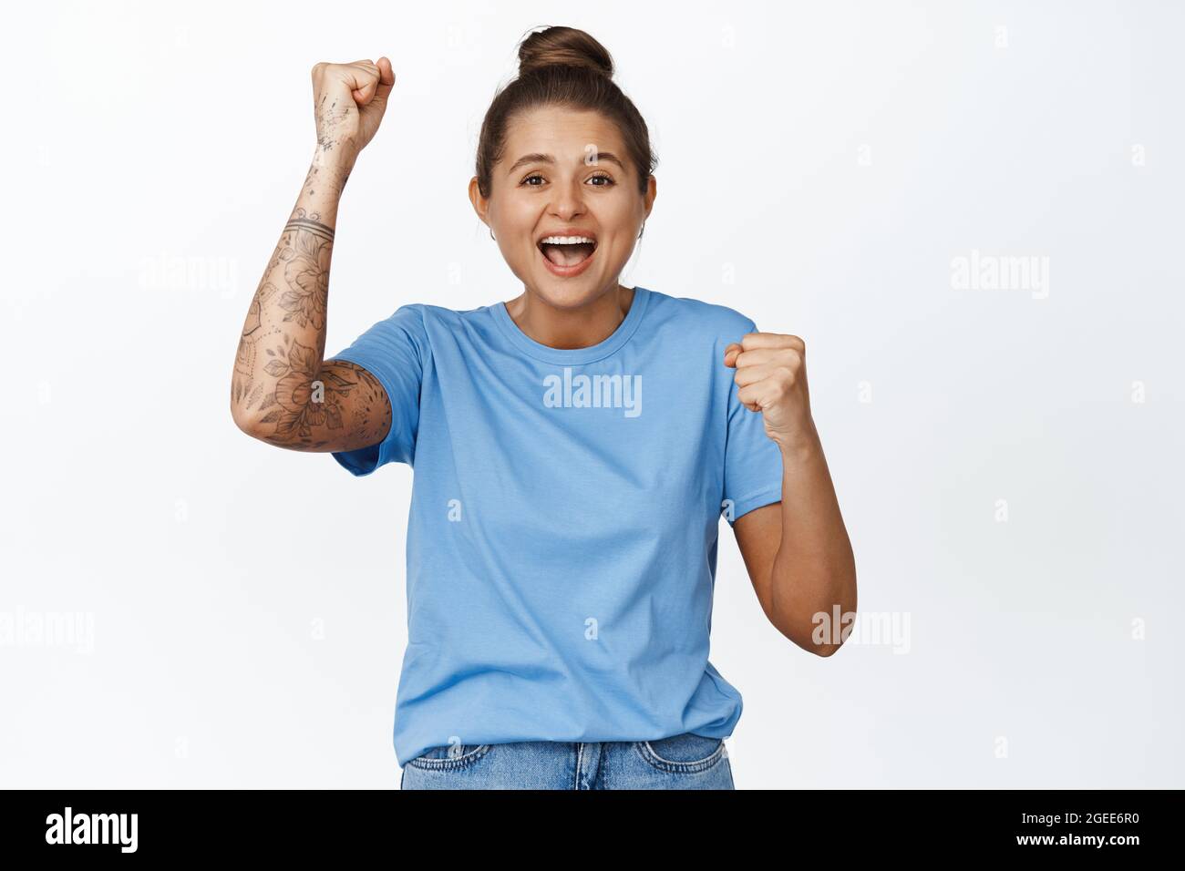 Excited girl rooting for team, watching sports game and chanting with ...