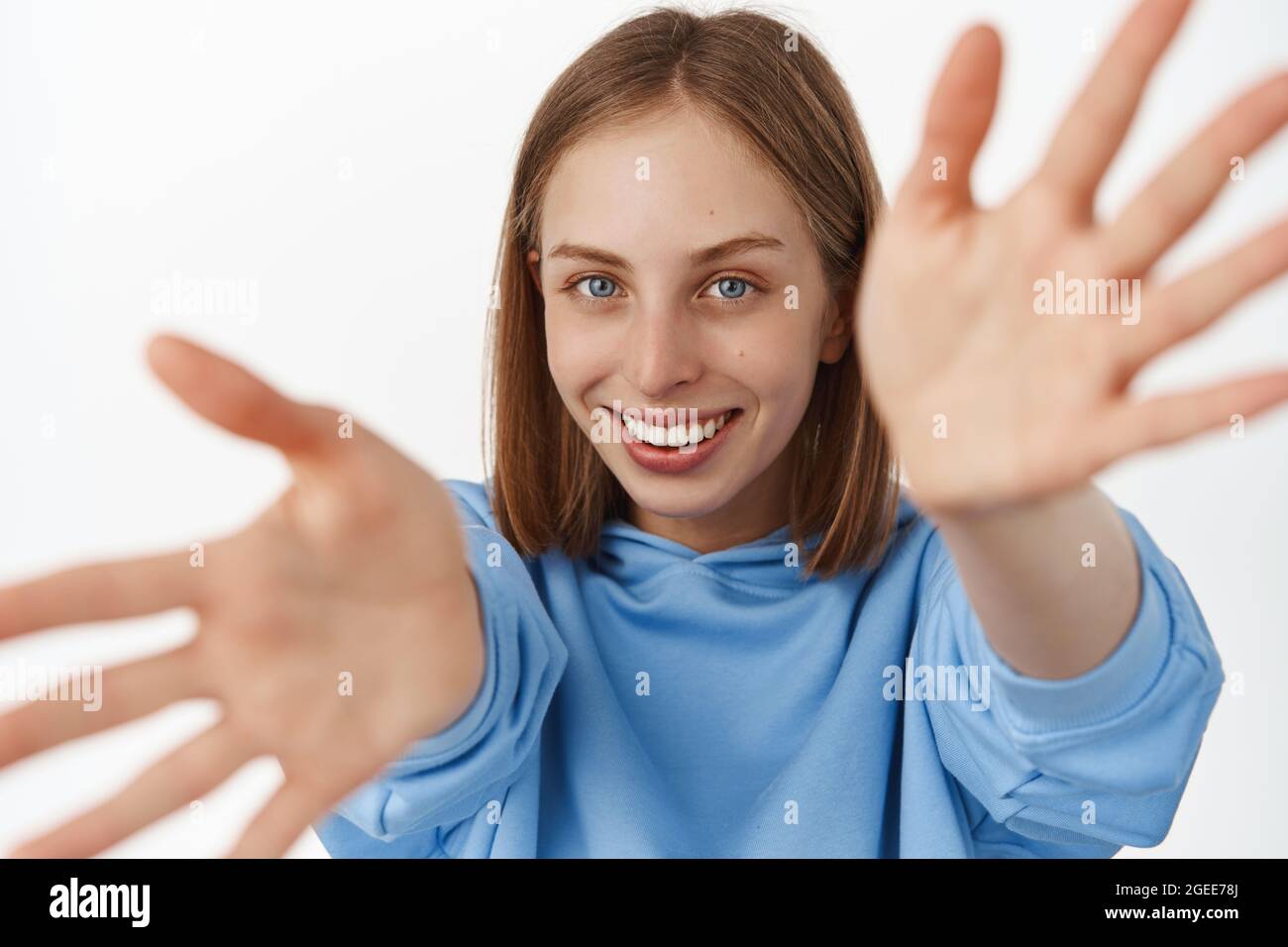 Happy portrait young women reaching hi-res stock photography and images ...