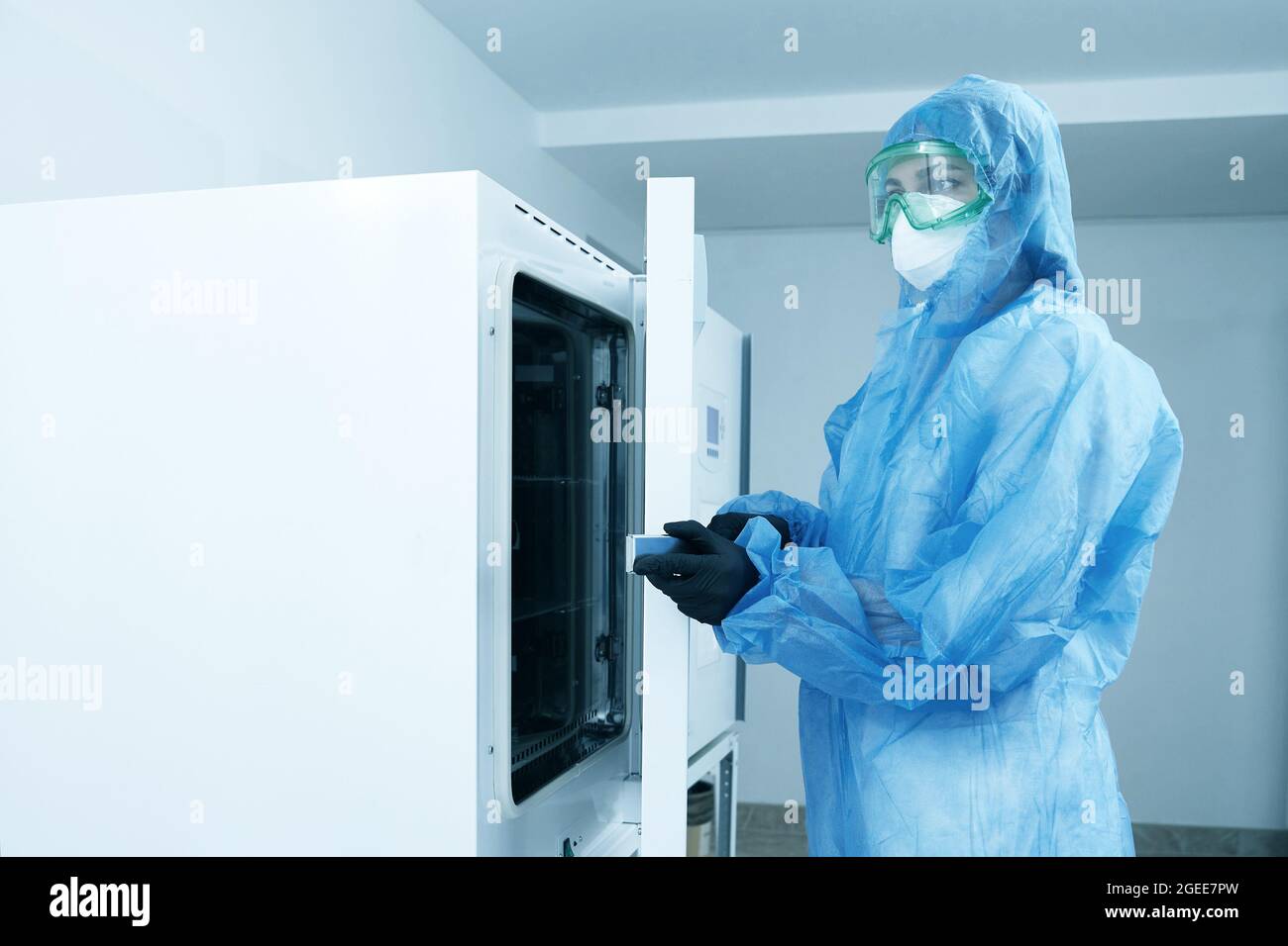 Laboratory worker operating Modern laboratory autoclave sterilizer ...