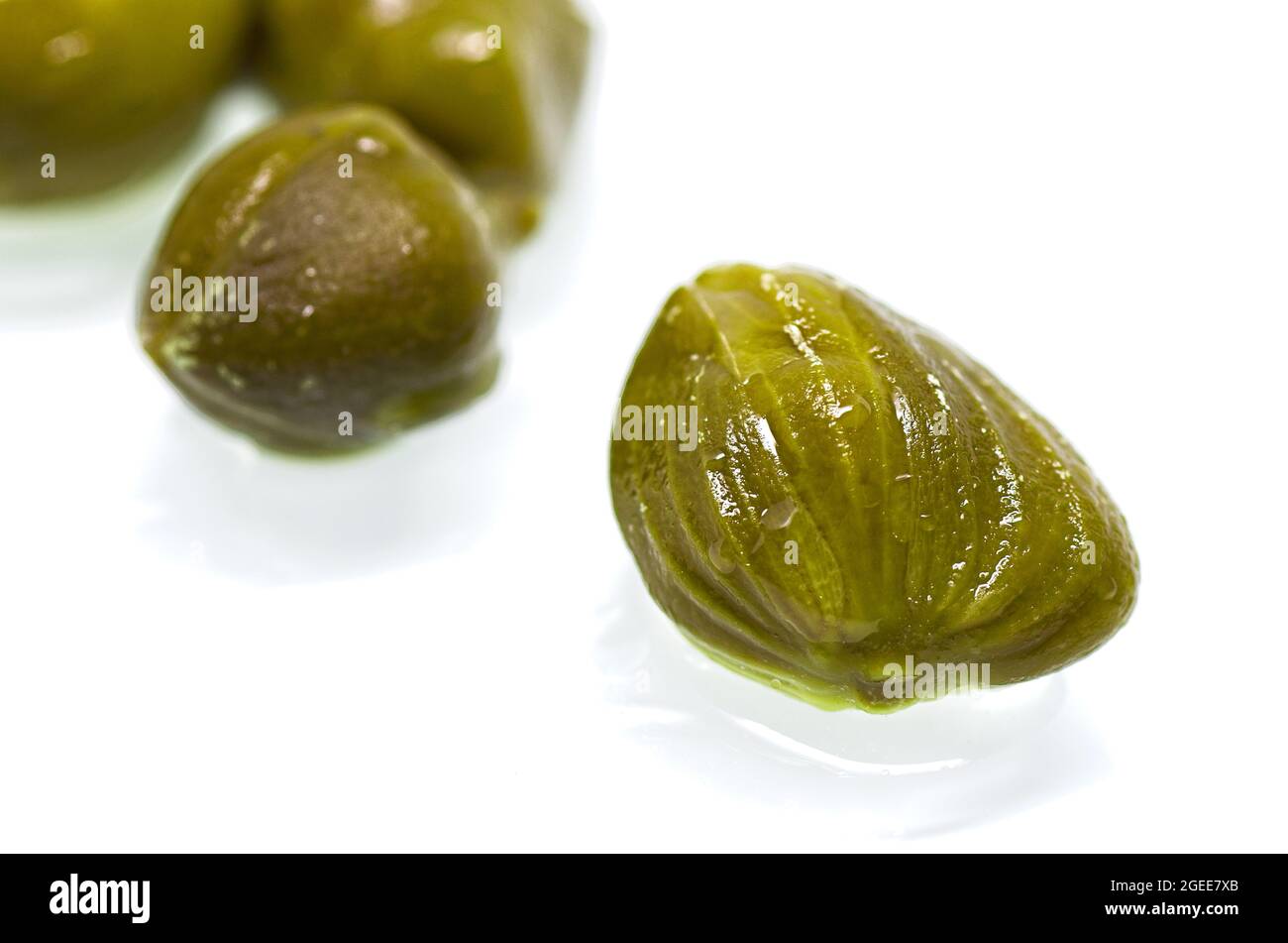 Green Capers isolated on a white background Stock Photo - Alamy