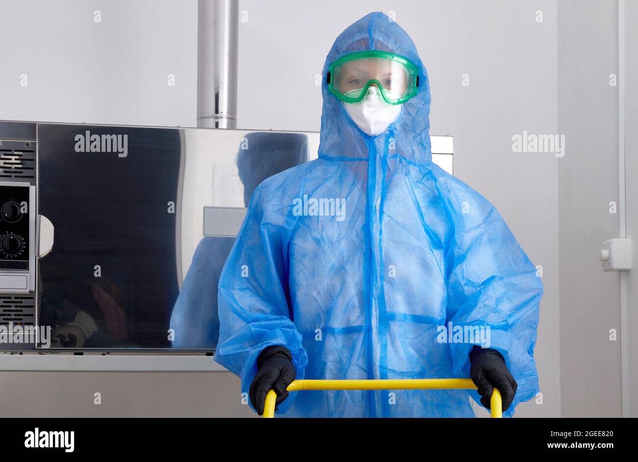 Laboratory worker operating Modern laboratory autoclave sterilizer ...