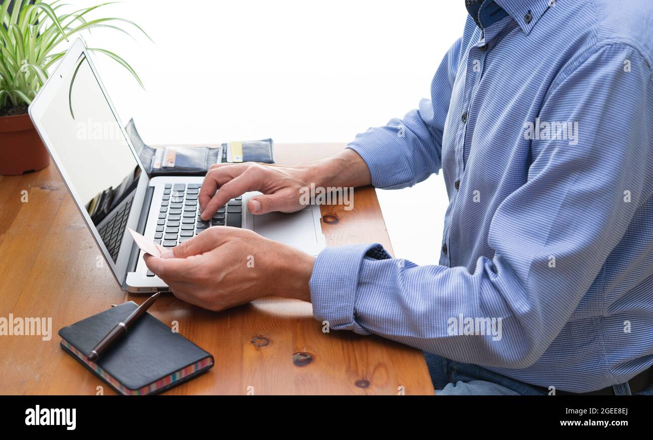Man making online payments in front of the computer Stock Photo - Alamy