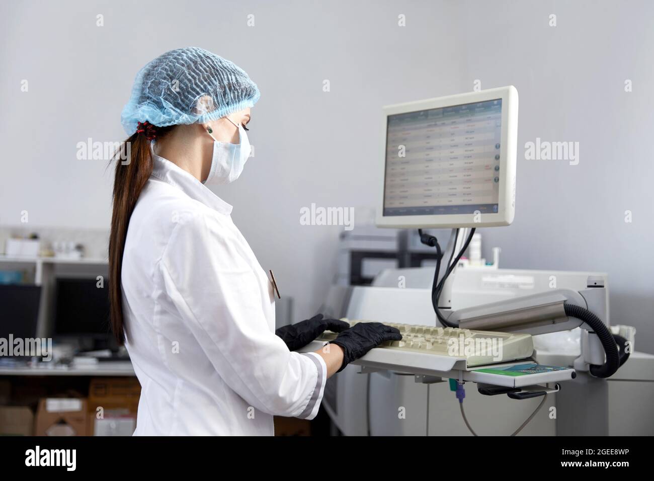 Scientist Working in Laboratory Using computer Screen Stock Photo - Alamy