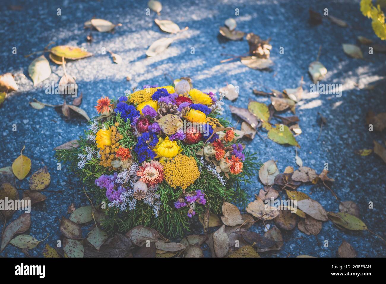 colorful floral decoration on grave in cemetery in autumn time Stock ...