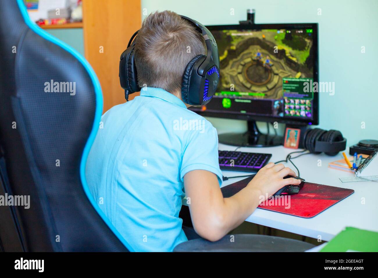 a boy plays in computer game Stock Photo - Alamy