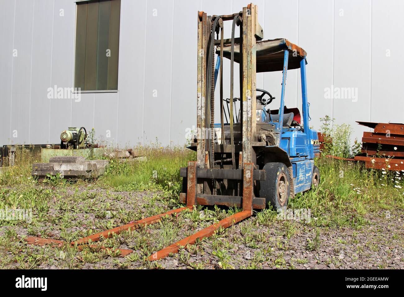disused fork lifter stored outdoors Stock Photo - Alamy