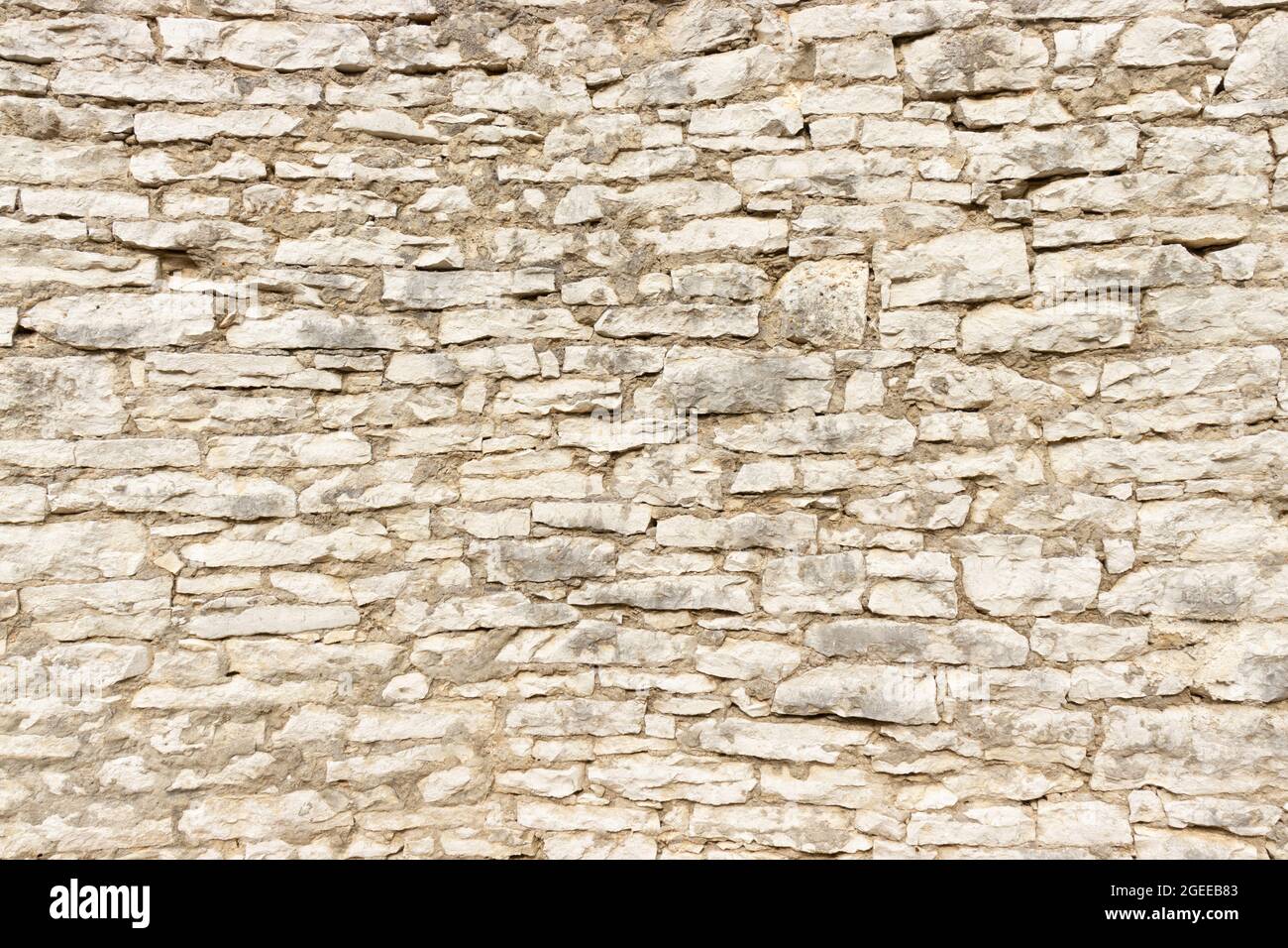 Large stone wall made by stacking small stone blocks Stock Photo - Alamy