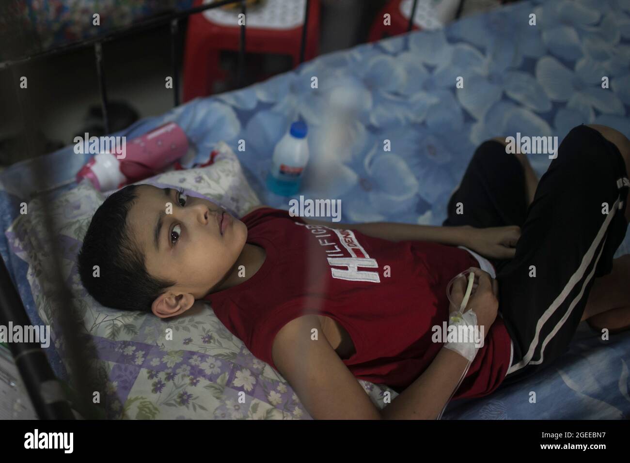 A sick child receives treatment inside the Dhaka Children's Hospital ...