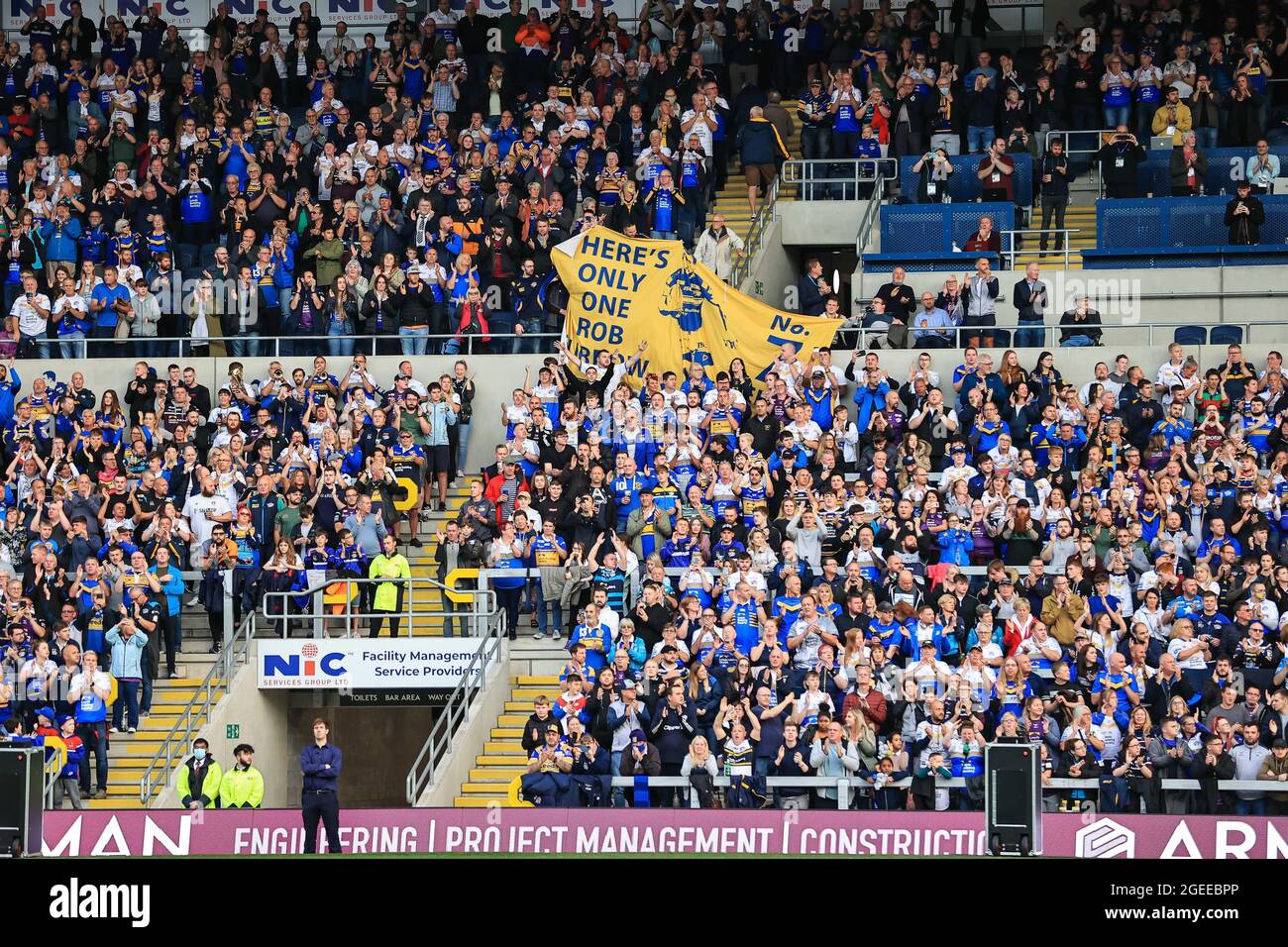 Standing ovation for Rob Burrows from the fans as they hold up his flag ...