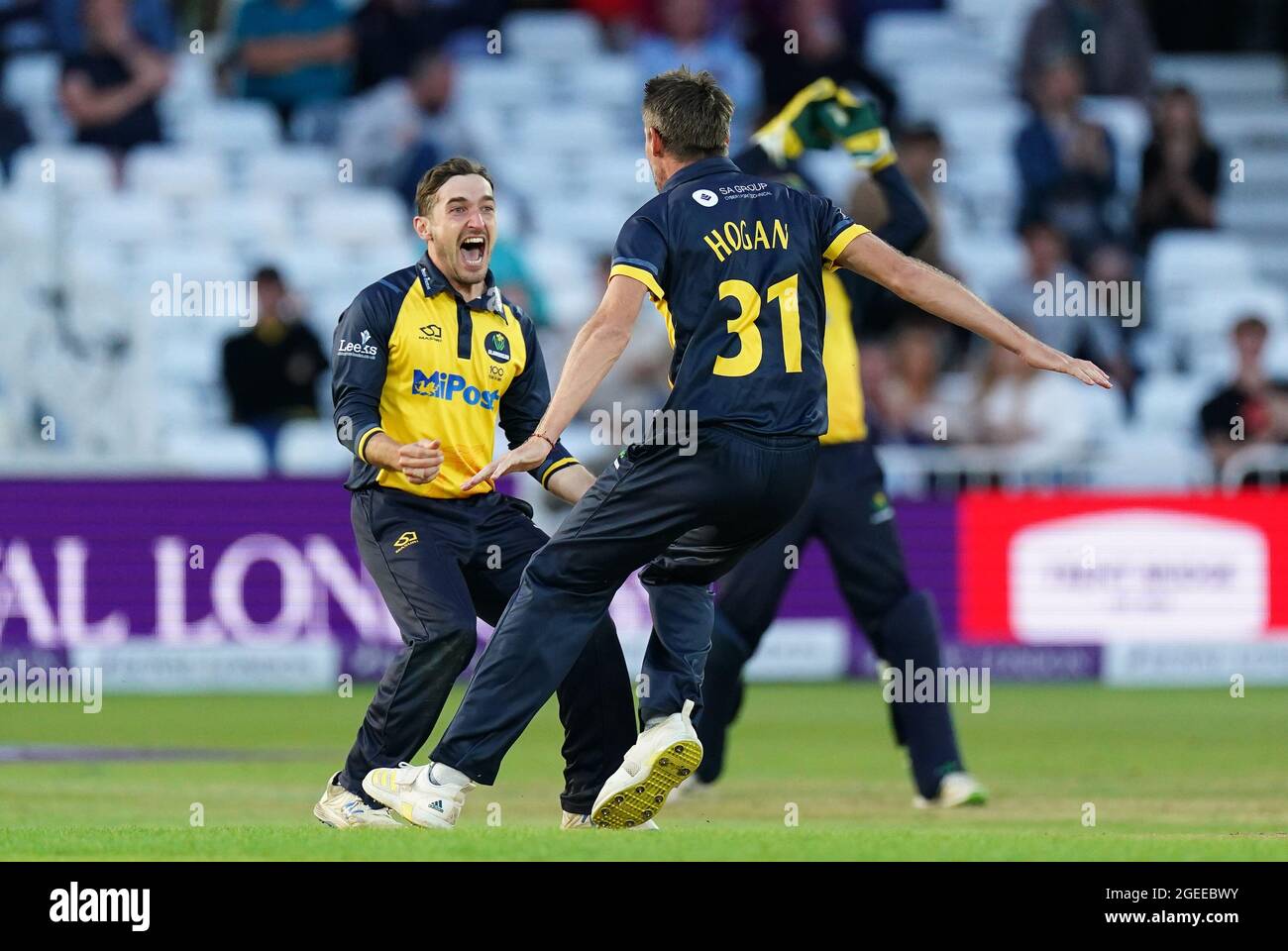 Glamorgan's Michael Hogan (right) celebrates with Andrew Salter after ...