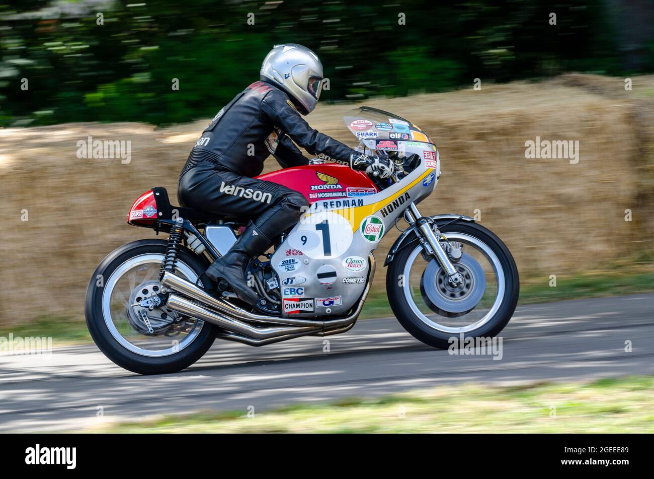 Jim Redman riding 1972 Honda CR750 motorcycle racing up the hill climb ...
