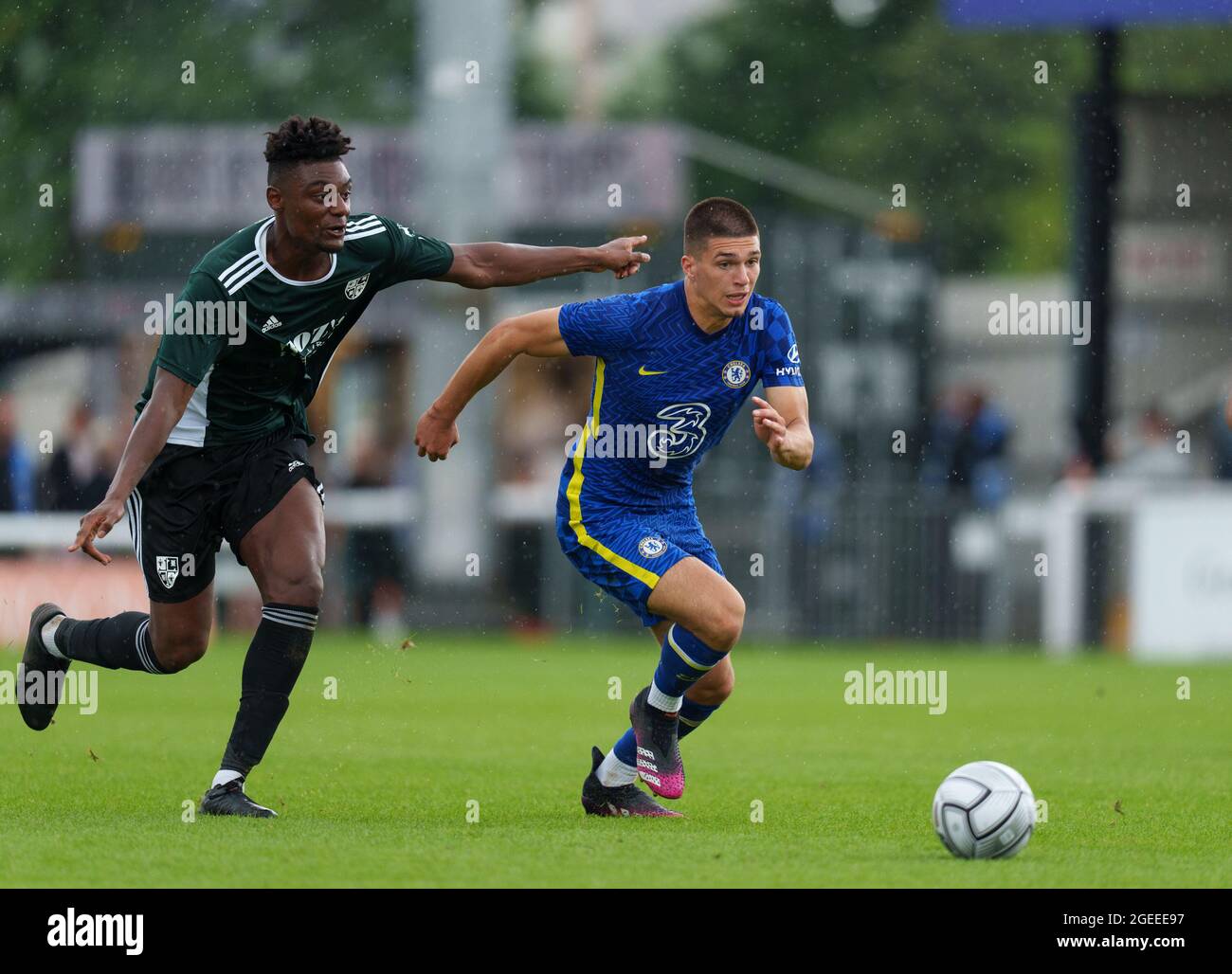 Woking, UK. 31st July, 2021. Xavier Simons of Chelsea U23 & Rohan Ince ...