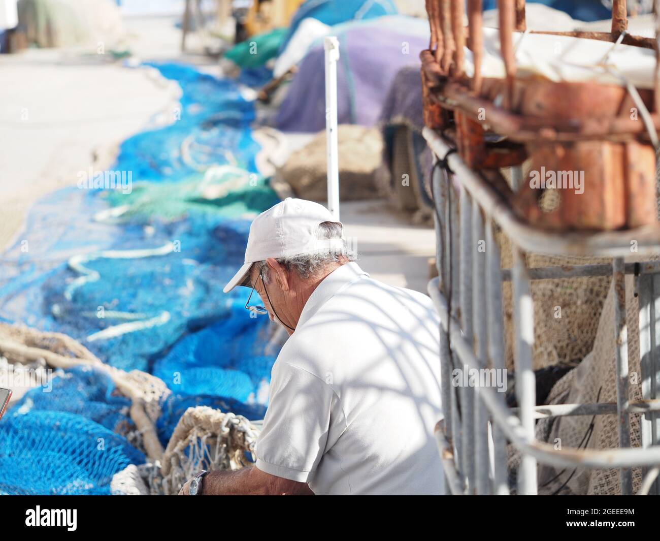 Fisherman holding fishing nets Stock Photo - Alamy