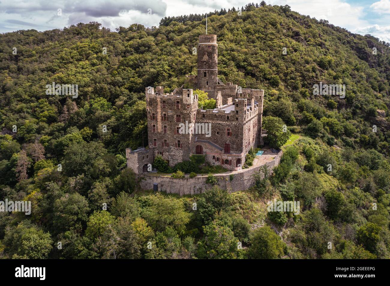 Aerial view of the Mouse Castle Surrounded by green forest landscape ...