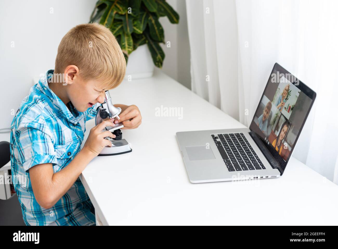 Smart Young Boy Works on a Laptop For His New Project in His Computer ...