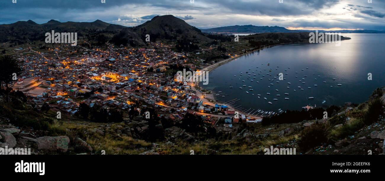 Evening aerial view of Copacabana town on the coast of Titicaca lake ...