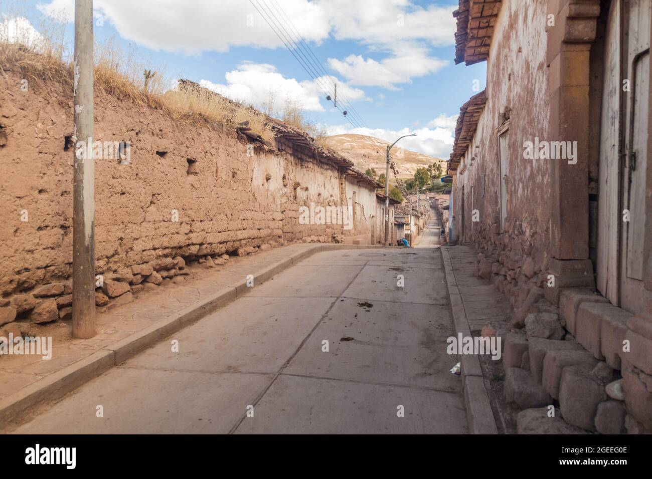 Street with traditional adobe houses in Maras village, Peru Stock Photo ...