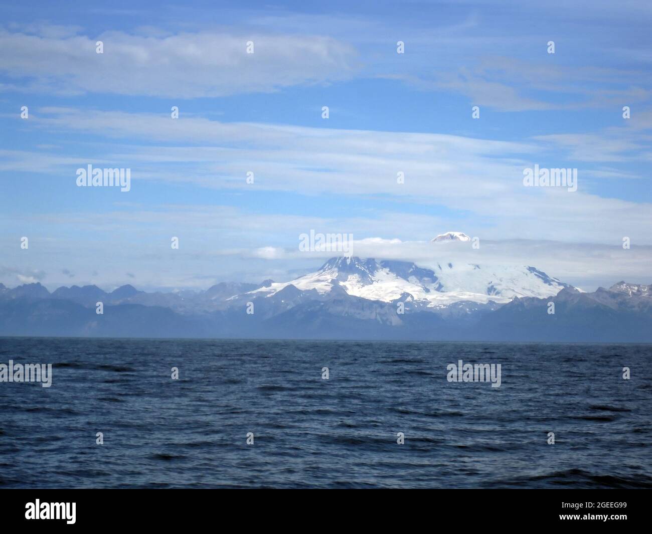 Beautiful snow capped Mount Illiama seem to rise out of Cook Inlet ...
