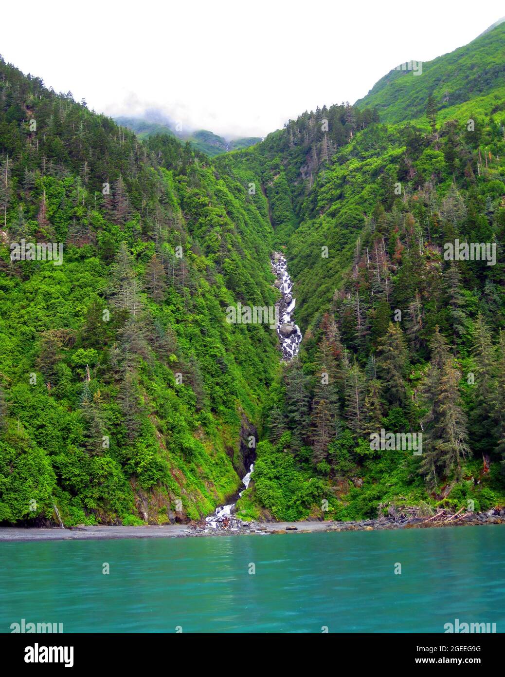 Beautiful waterfall cascades down a high mountain on Prince William ...