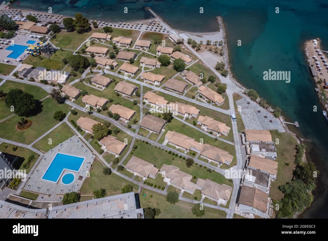 Aerial drone view of Messonghi Beach Holiday Resort over the canal ...