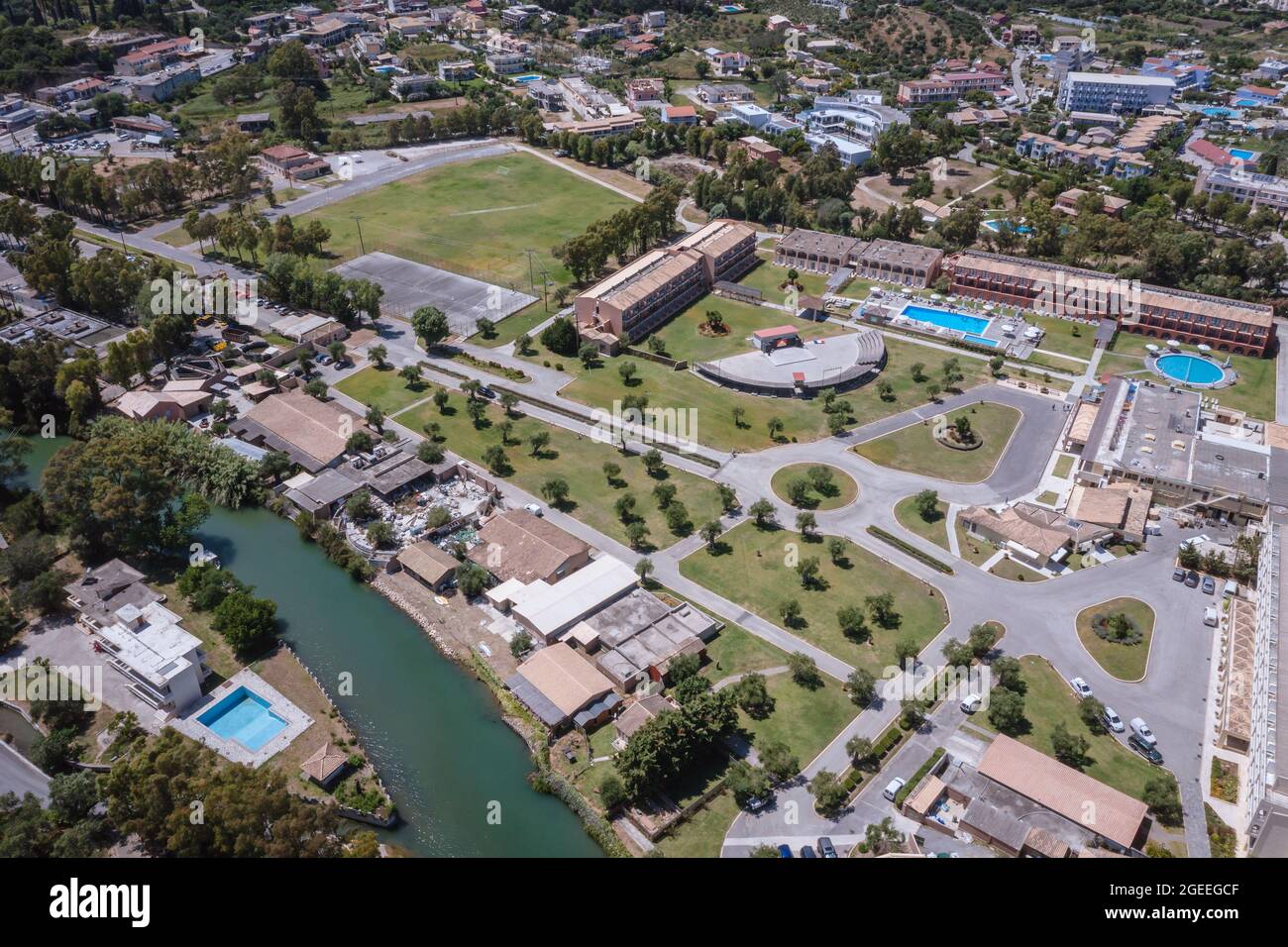 Aerial drone view of Messonghi Beach Holiday Resort over the canal ...