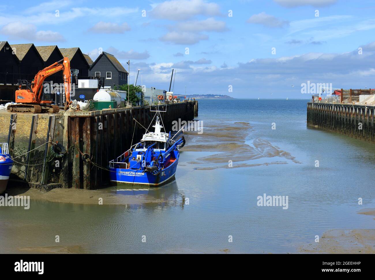 Low tide in the harbour at Whitstable on the Kent coast Stock Photo - Alamy