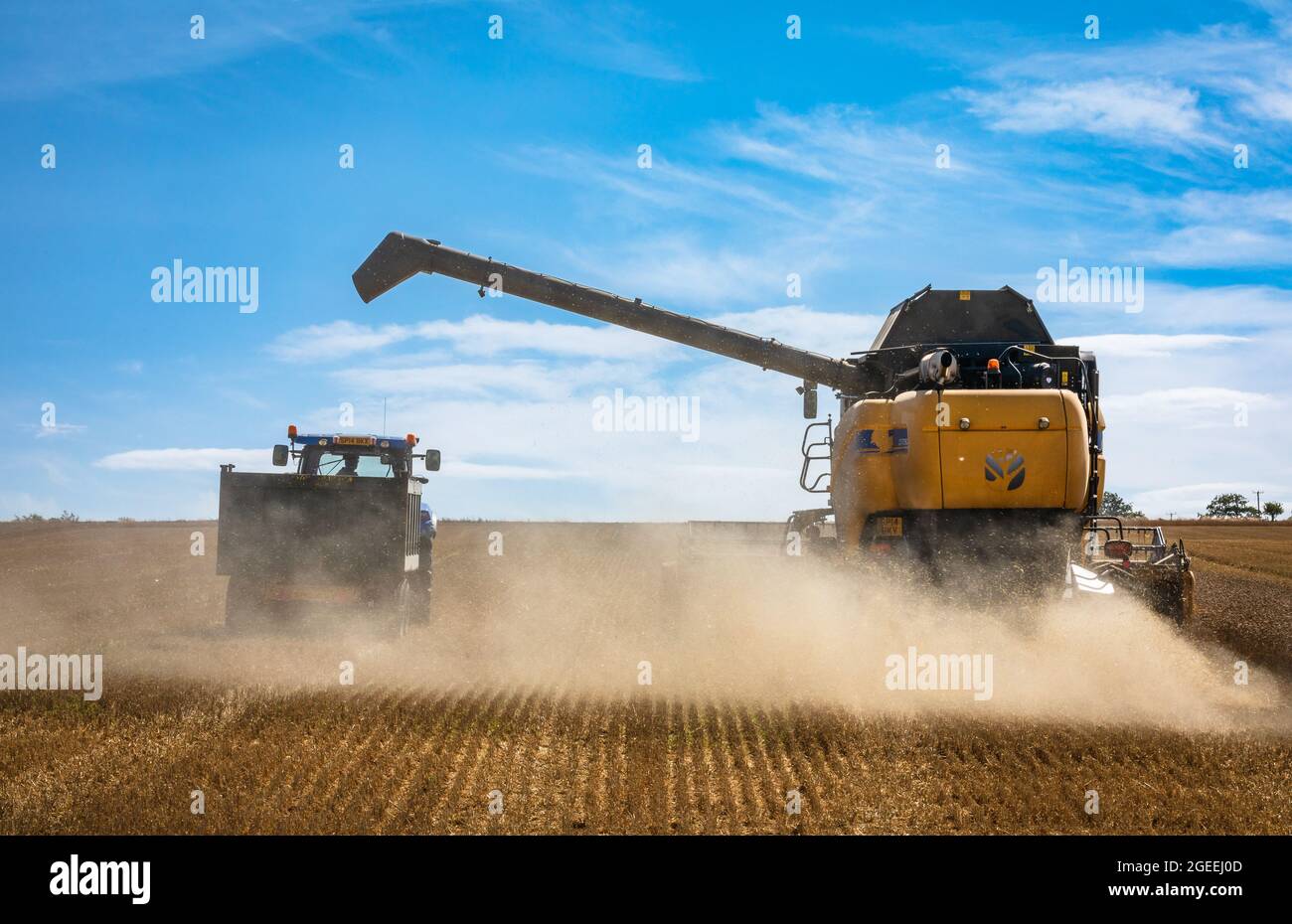 Combine harvester operating in field near Cupar, Fife, Scotland, UK ...