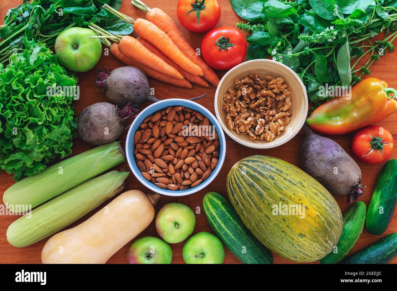 Organic fresh vegetables, almonds and walnuts. Vegan healthy raw food ...