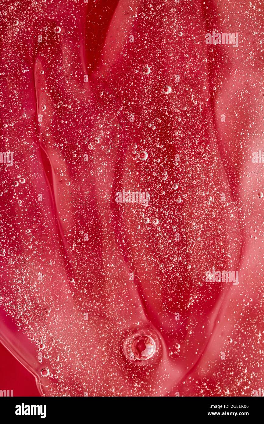 Abstract red liquid background, paint splash, swirl pattern and water ...