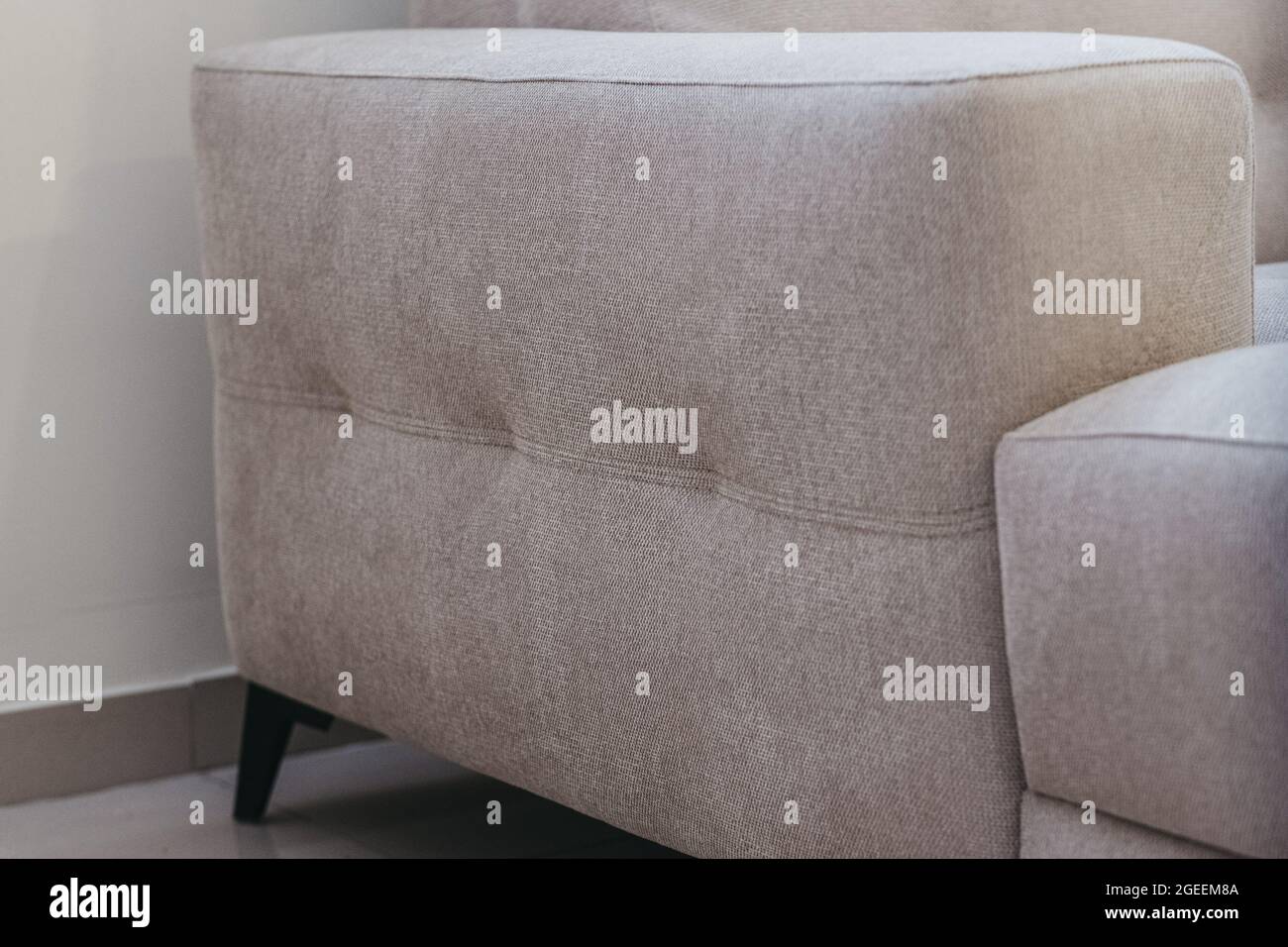 Detail shot of a greige couch in a living room Stock Photo - Alamy