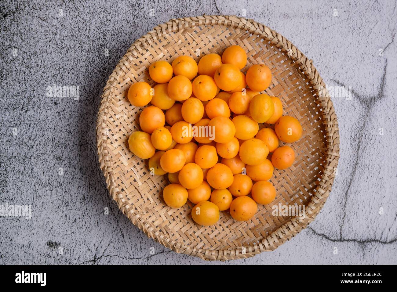 Brazilian fruit caja in the straw basket Stock Photo - Alamy