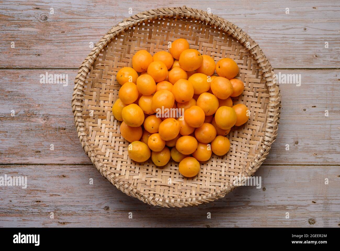 Brazilian fruit caja in the straw basket Stock Photo - Alamy