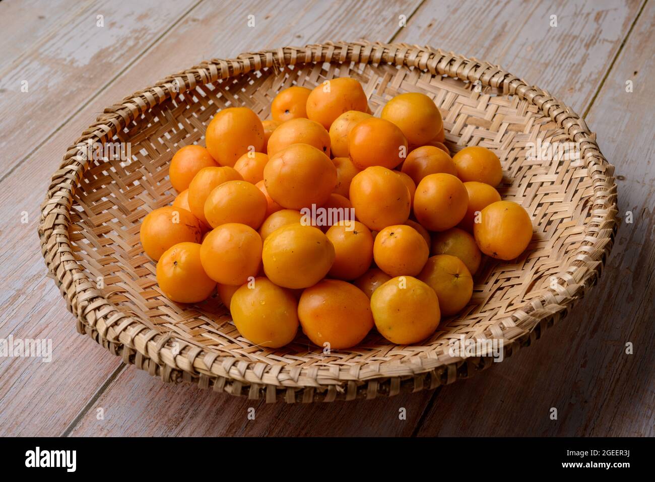 Brazilian fruit caja in the straw basket Stock Photo - Alamy