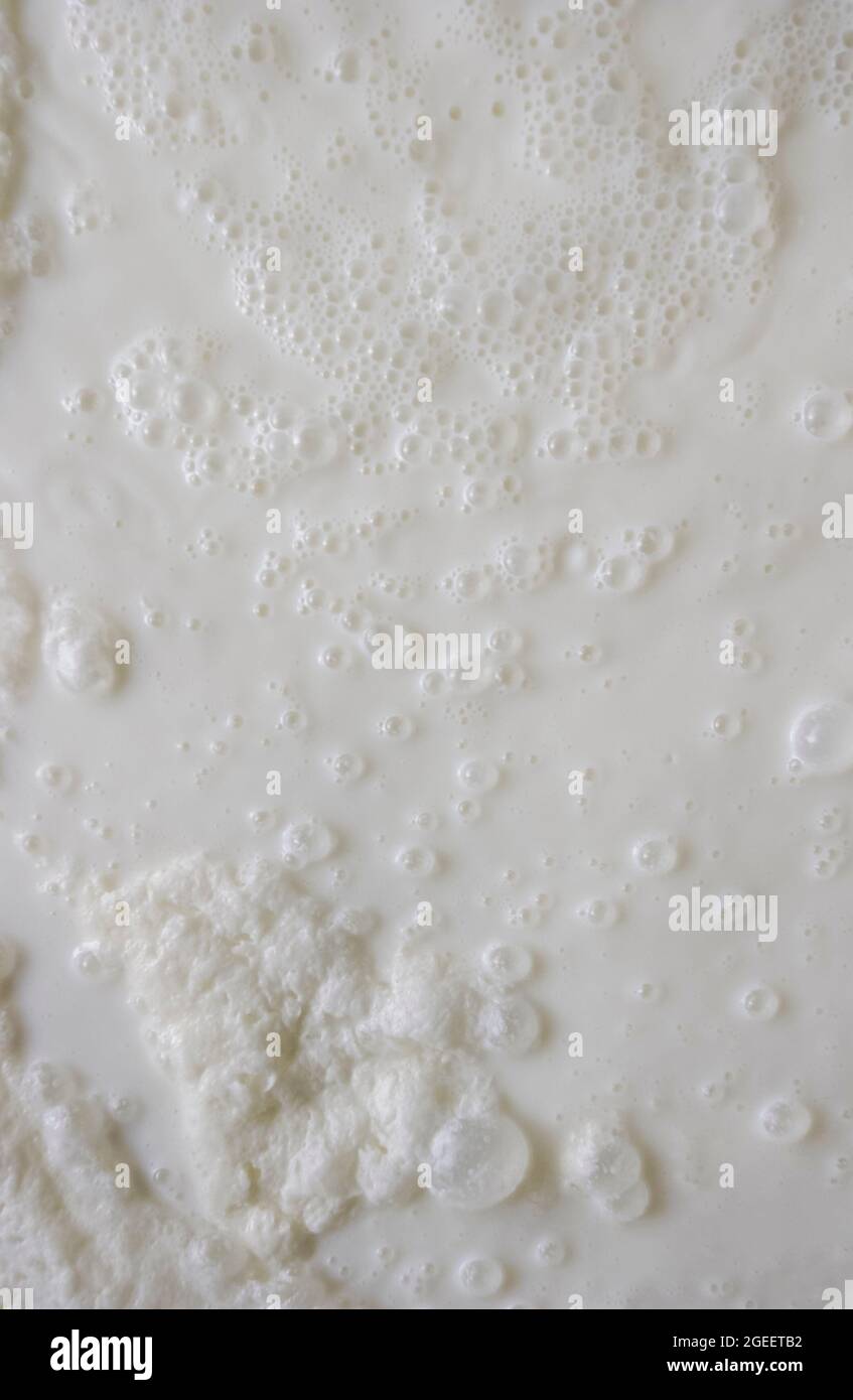 Fresh milk. Bubbles forming scene background Stock Photo - Alamy
