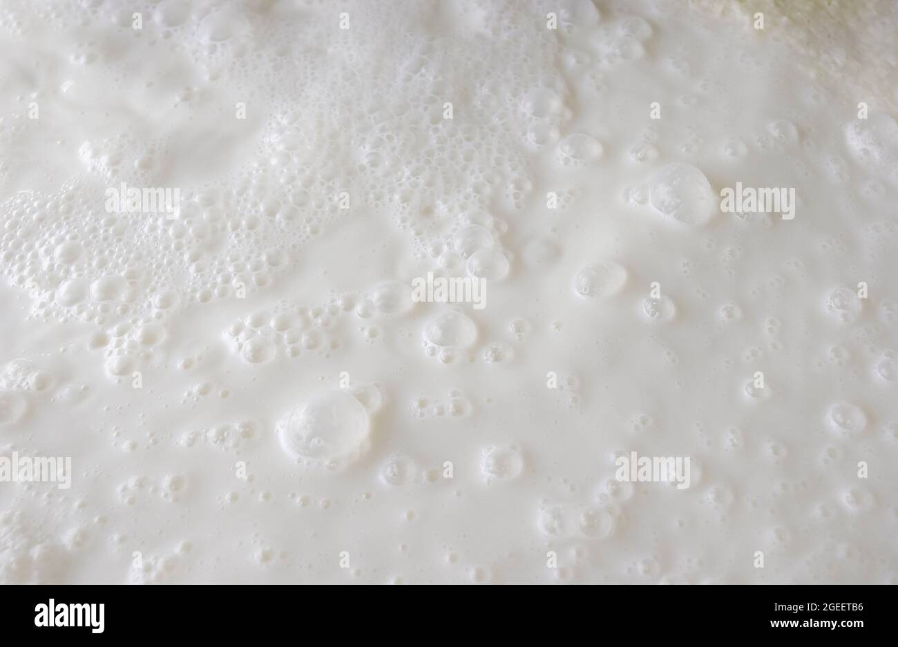 Fresh milk. Bubbles forming scene background Stock Photo - Alamy