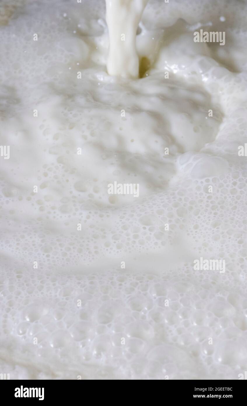 Fresh milk. Bubbles forming scene background Stock Photo - Alamy