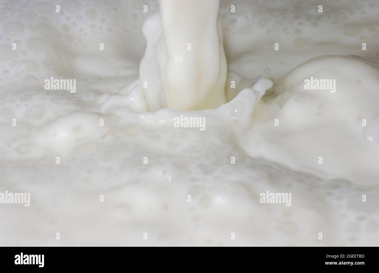 Fresh milk. Bubbles forming scene background Stock Photo - Alamy