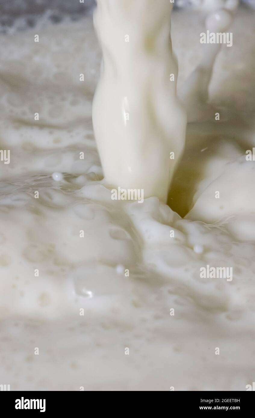 Fresh milk. Bubbles forming scene background Stock Photo - Alamy