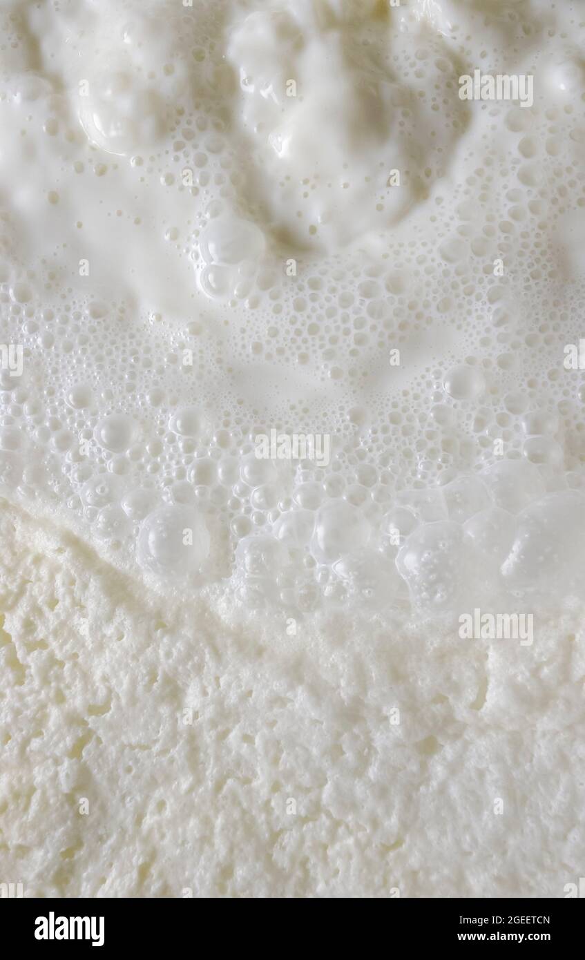 Fresh milk. Bubbles forming scene background Stock Photo - Alamy