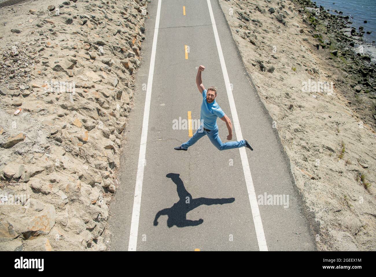 Guy jumping on road hi-res stock photography and images - Alamy