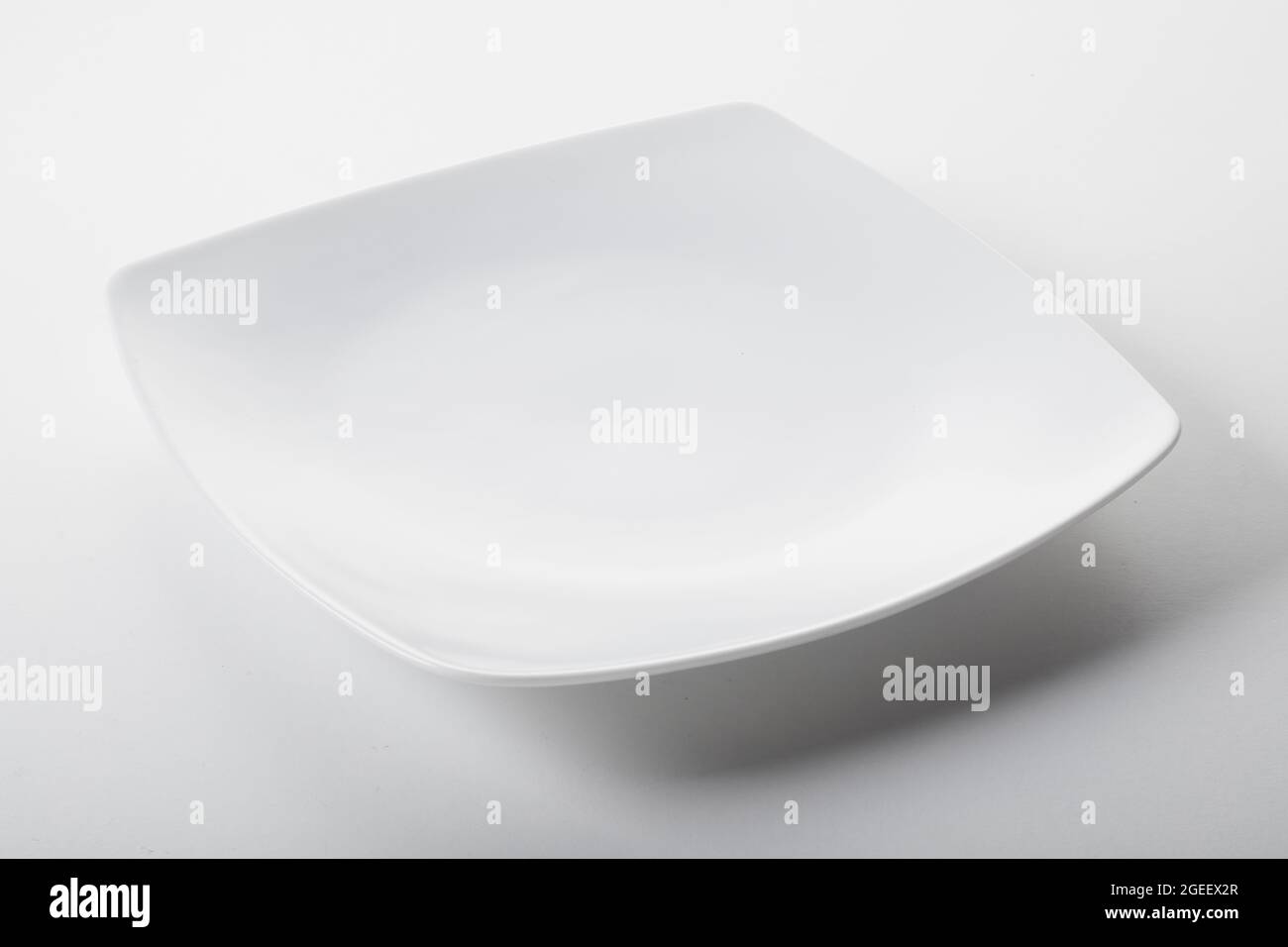 White square curved plate in minimalist style on white background Stock ...