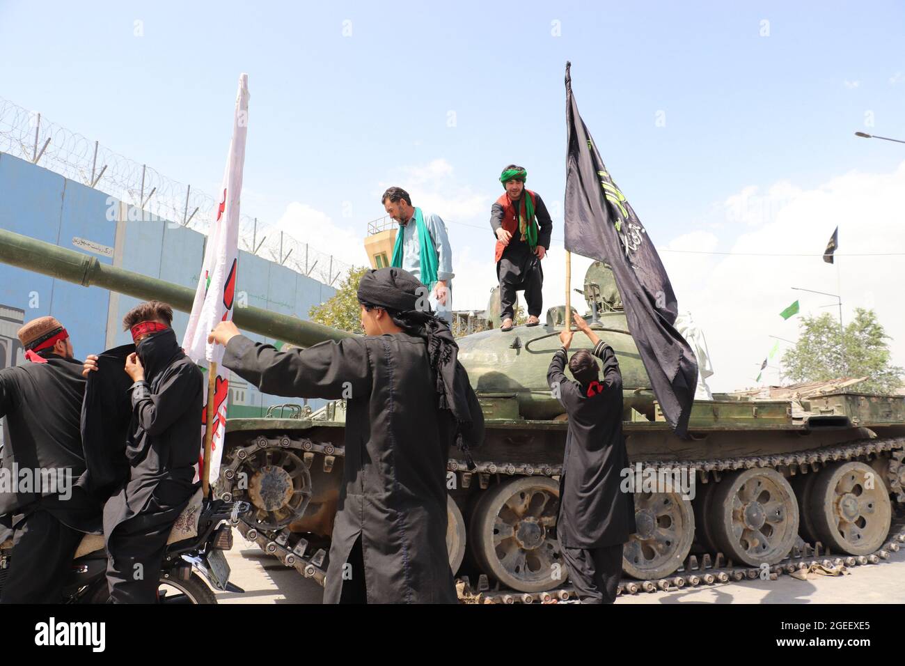 Kabul, Afghanistan. 19th Aug, 2021. Afghan Shiite Muslims hold their ...